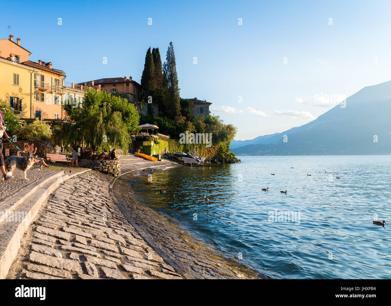 Panoramic view at sunset over the small village of Varenna, Lake Como ...
