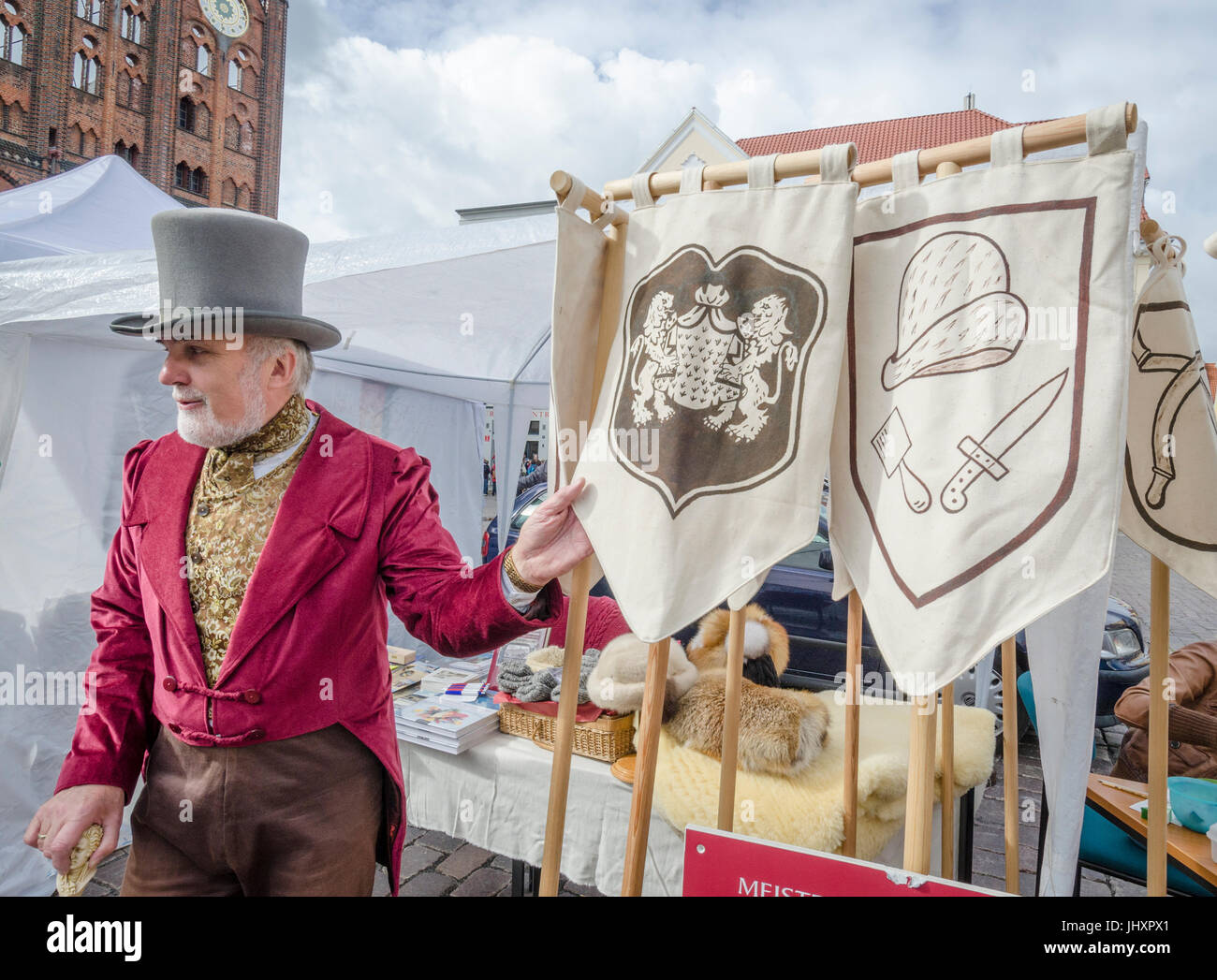 Craft market trader in traditional German costume, Stralsund, Germany ...