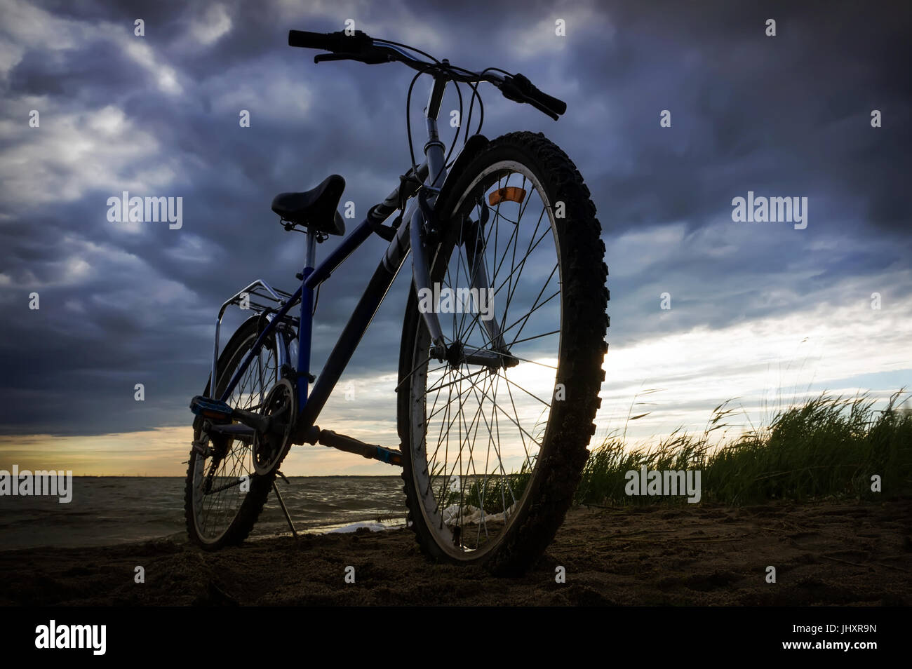 Traveling by bicycle. Beautiful scenery with a bicycle. Sunset on the ...