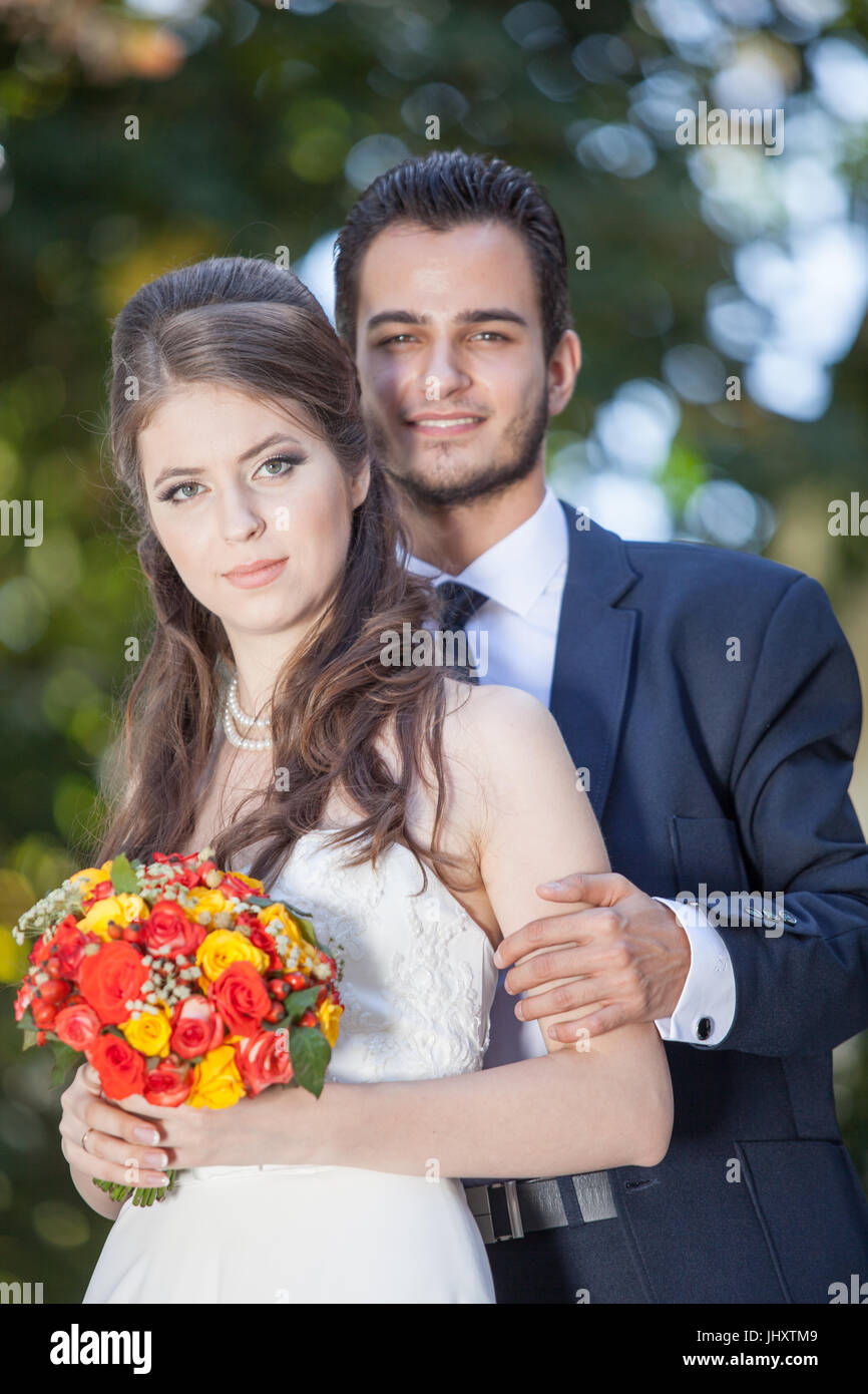 Just married husband and wife taking wedding photo Stock Photo - Alamy