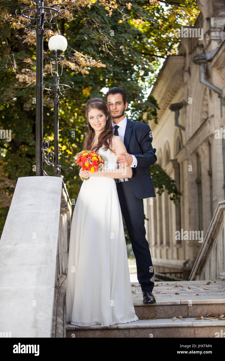 Just married husband and wife taking wedding photo Stock Photo - Alamy