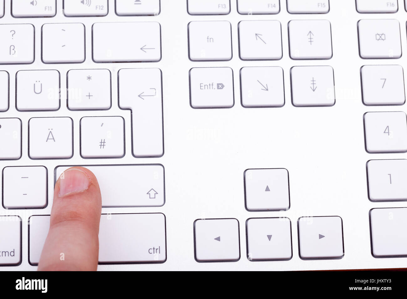 Finger pressing on keyboard Stock Photo - Alamy