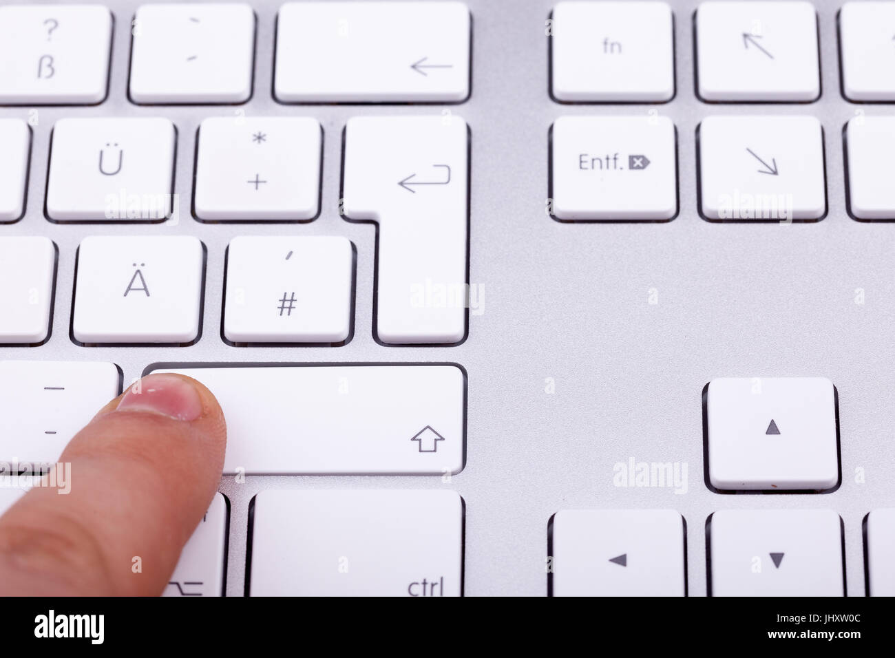 Finger pressing on keyboard Stock Photo - Alamy