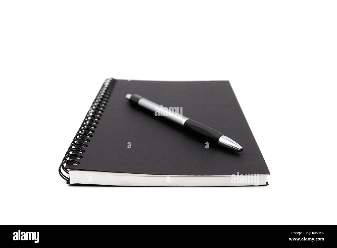 Notebook and pen isolated on white background Stock Photo - Alamy