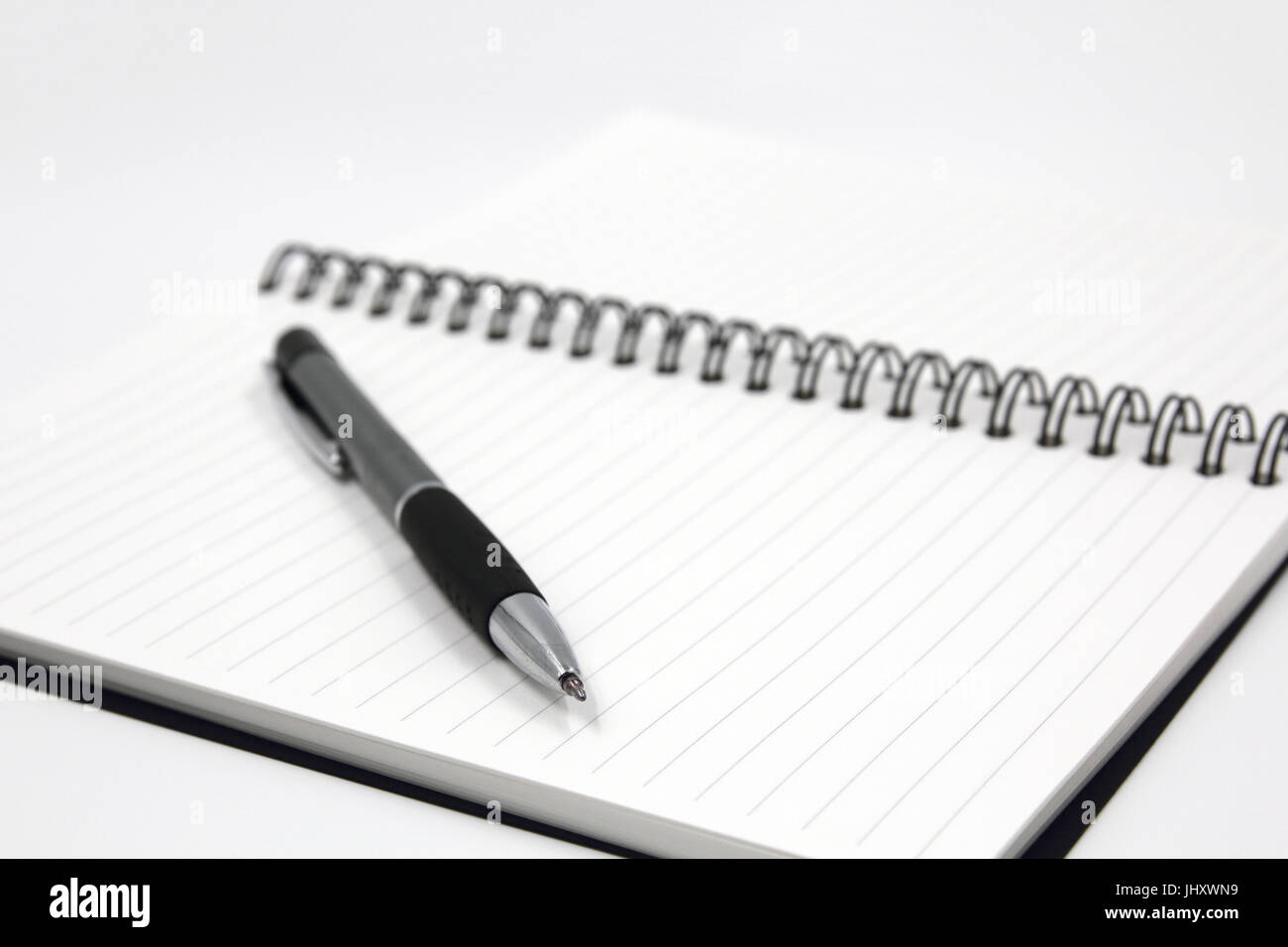 Notebook and pen isolated on white background Stock Photo - Alamy