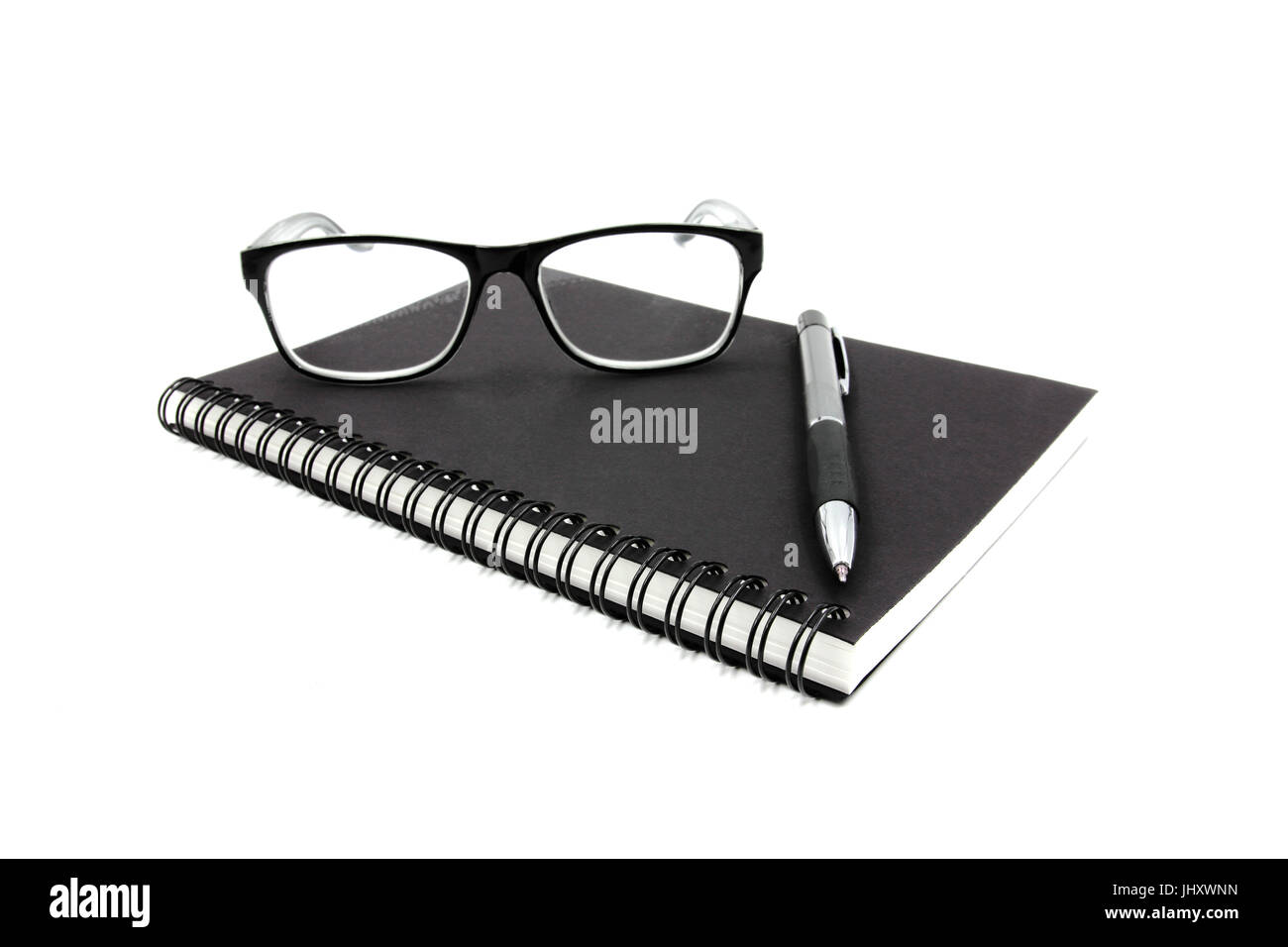 Notebook glasses and pen on white background Stock Photo - Alamy