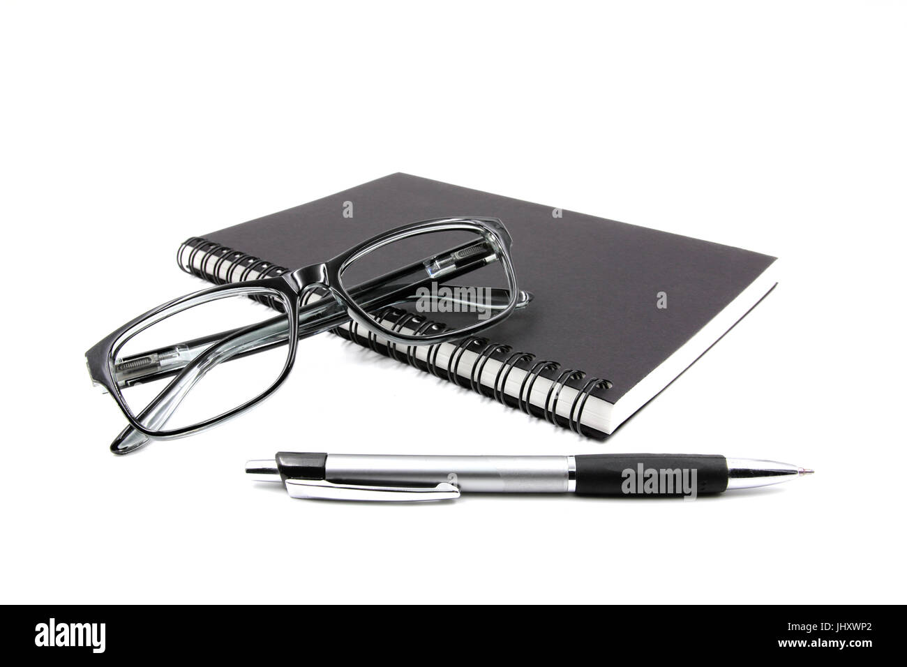 Notebook glasses and pen on white background Stock Photo - Alamy