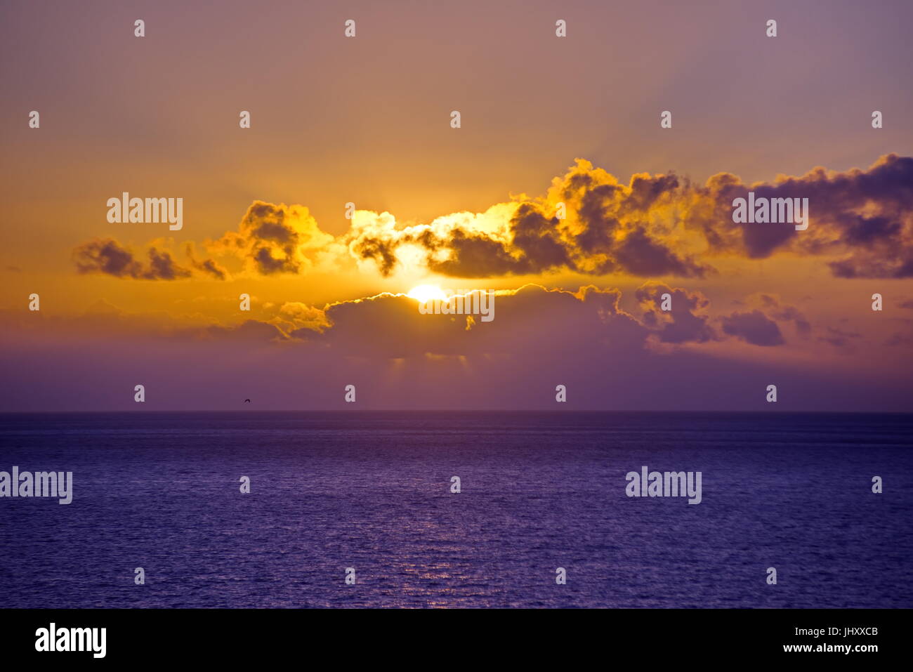 sunset over ocean Stock Photo - Alamy