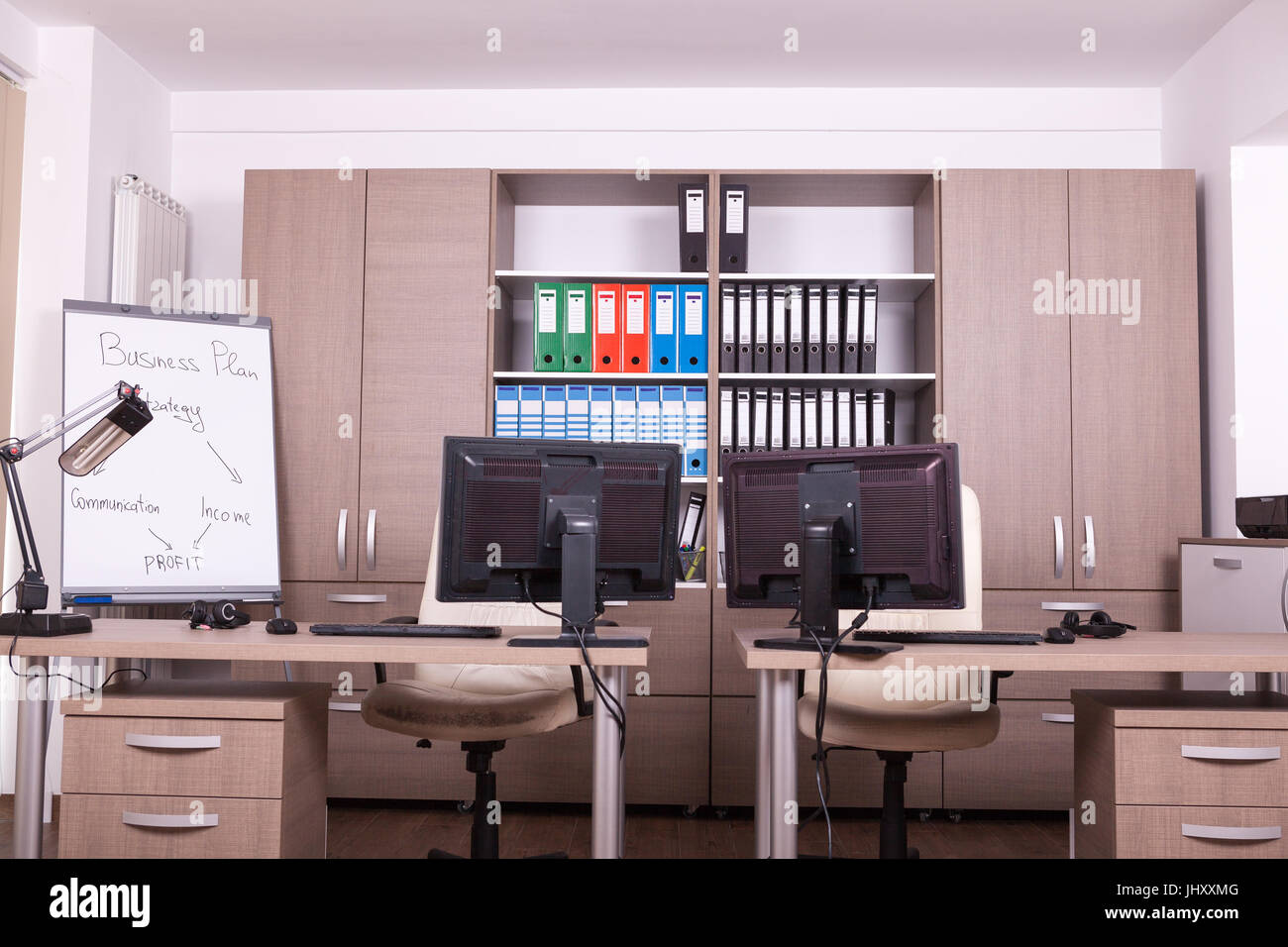 Empty office room with computers and desks Stock Photo - Alamy