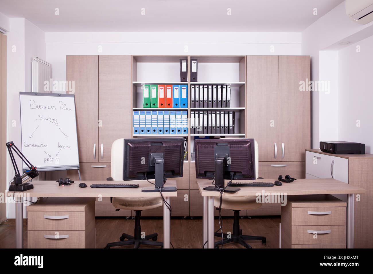 Empty office room with computers and desks Stock Photo - Alamy