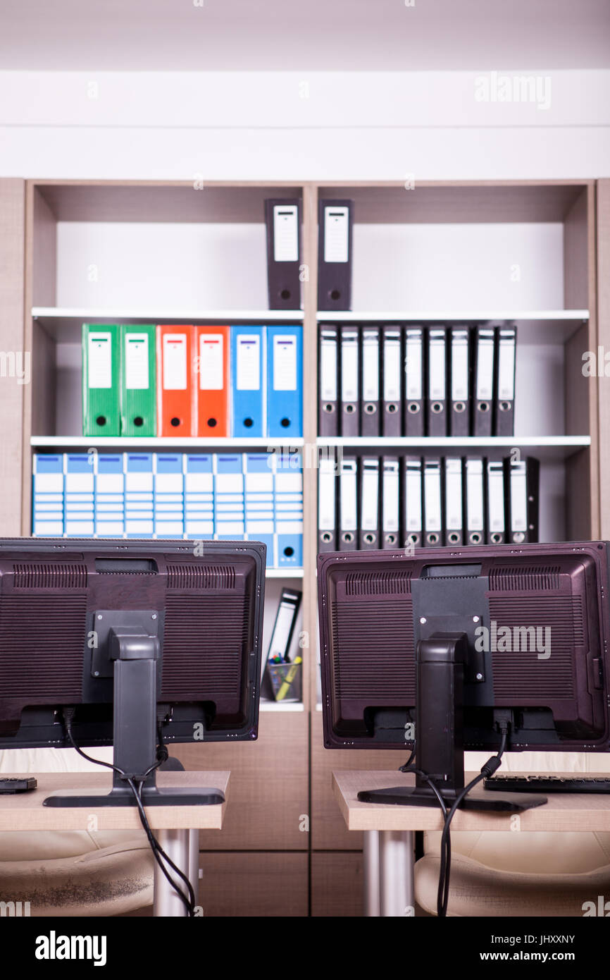 Empty office room with computers and desks Stock Photo - Alamy