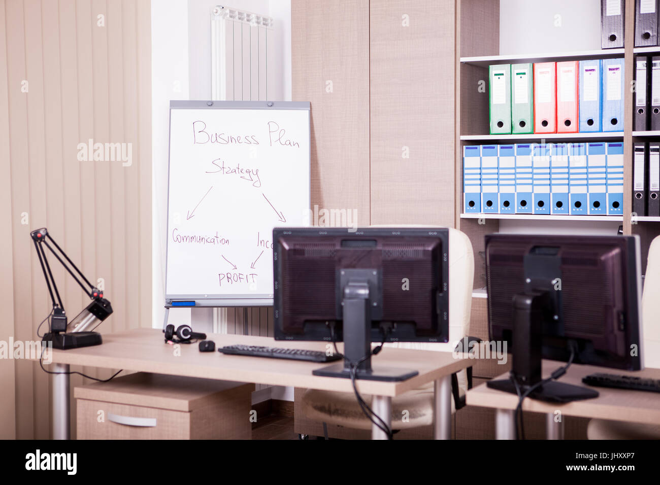 Empty office room with computers and desks Stock Photo - Alamy