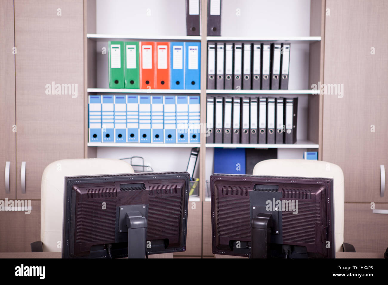 Empty office room with computers and desks Stock Photo - Alamy