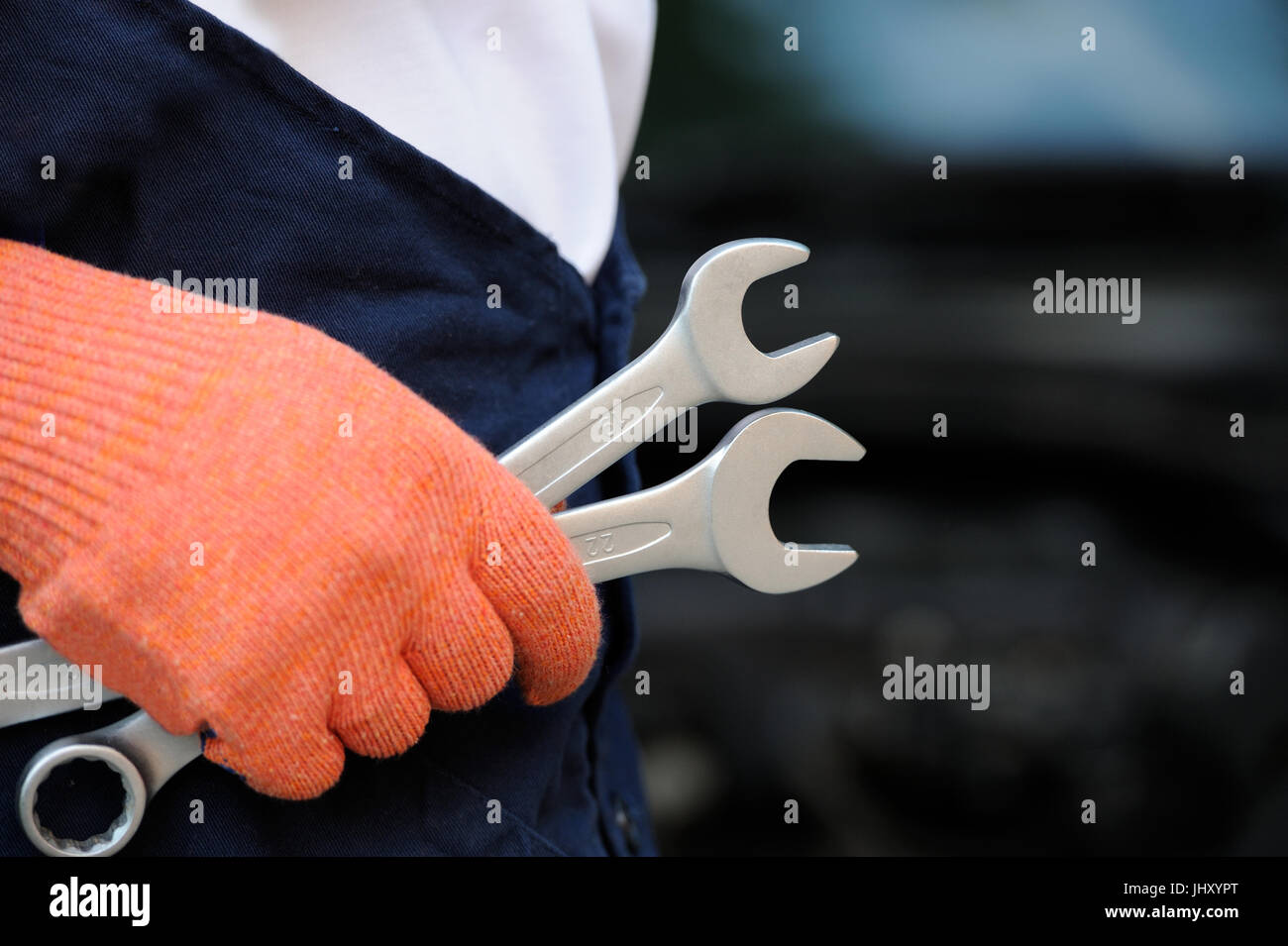 Hand mechanic holding wrench hi-res stock photography and images - Alamy