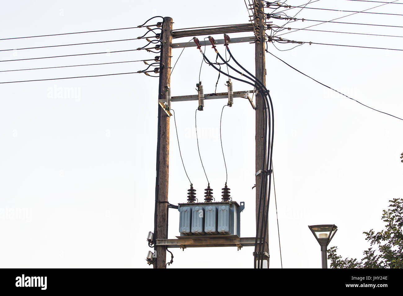 Voltage power transformer on electricity post Stock Photo - Alamy