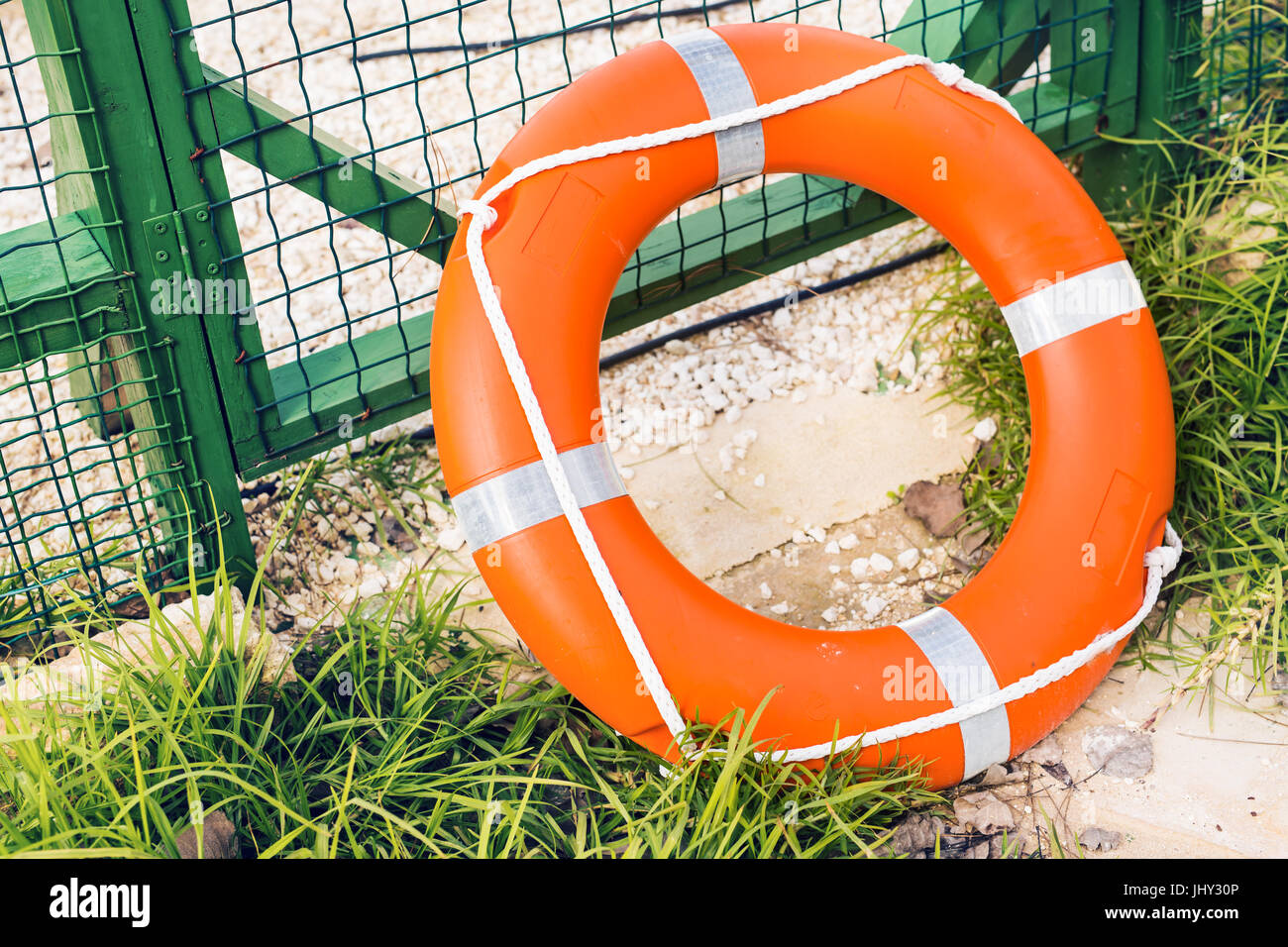 Marine lifebuoy on fence Stock Photo - Alamy