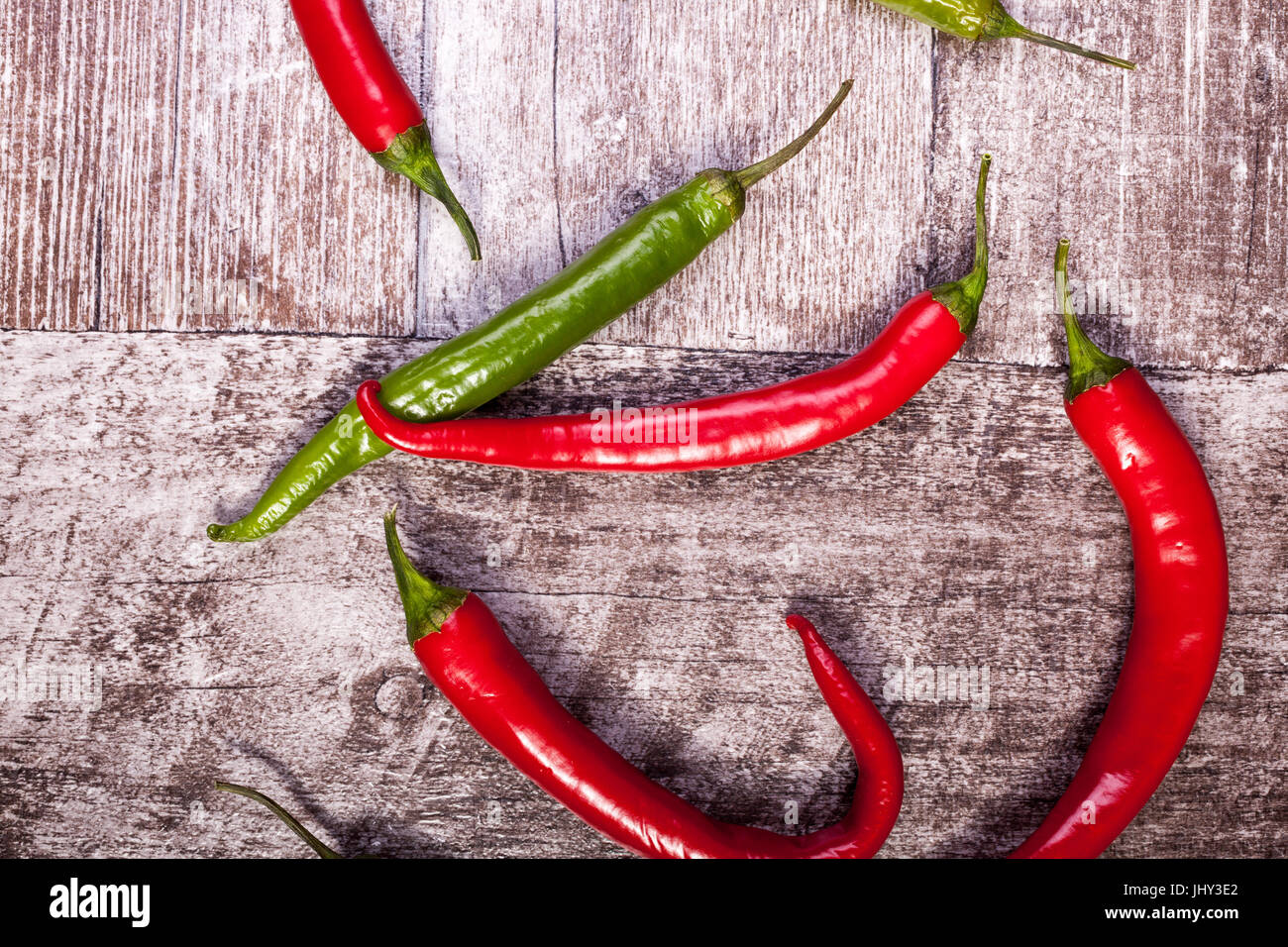 Spicy pepper on wooden background Stock Photo - Alamy