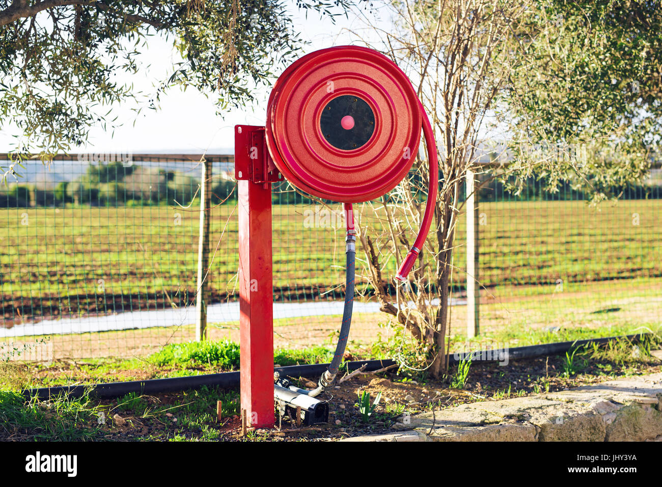 Fire safety equipment. Fire hose Stock Photo - Alamy