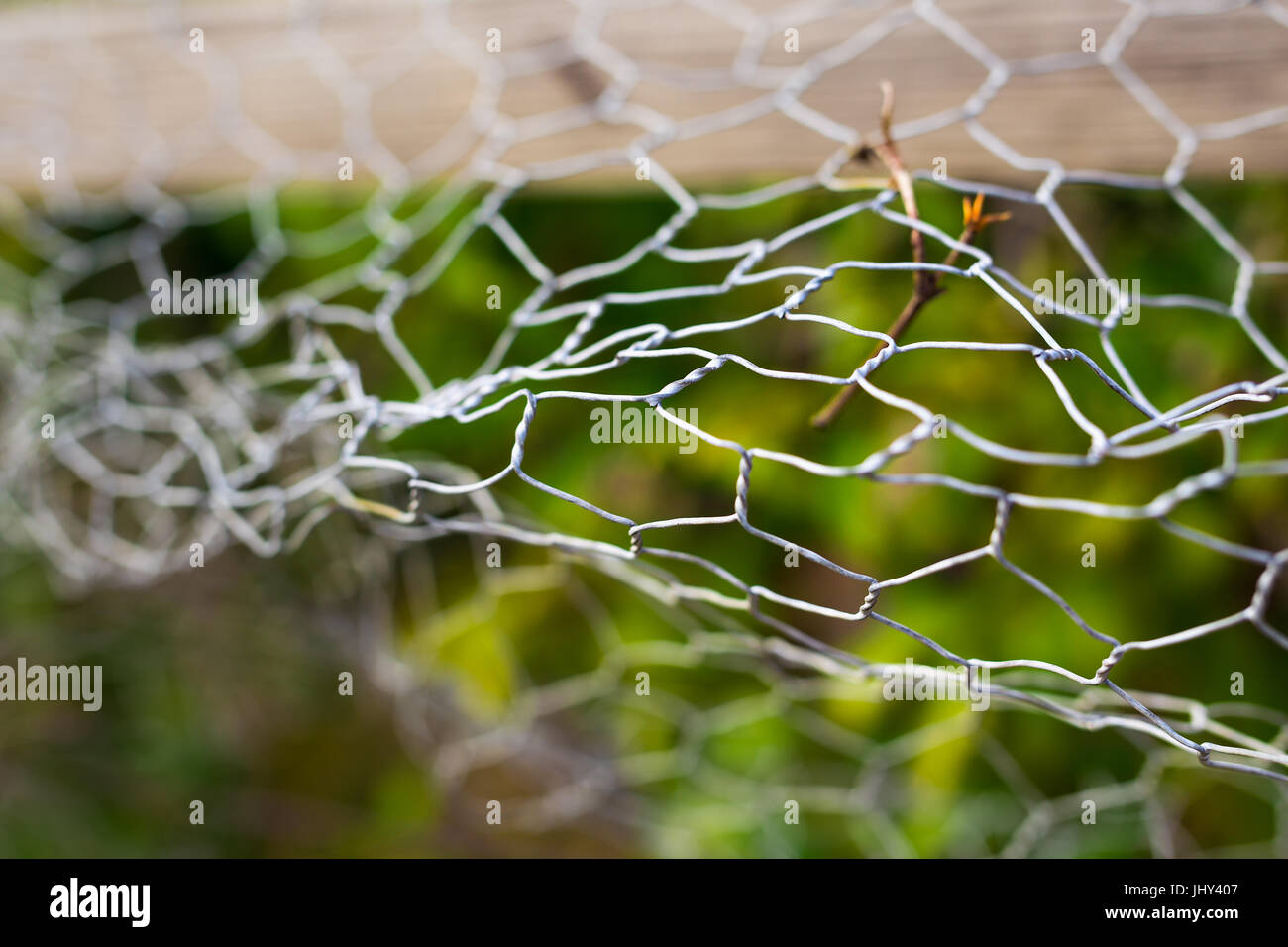 Fence with broken wire Stock Photo - Alamy