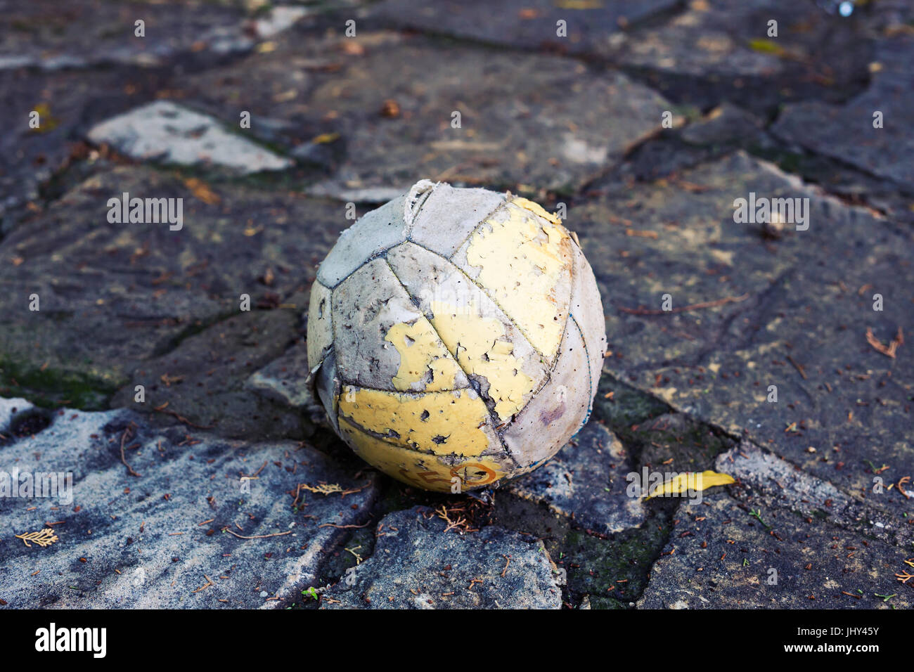 Football round worn ball hi-res stock photography and images - Alamy