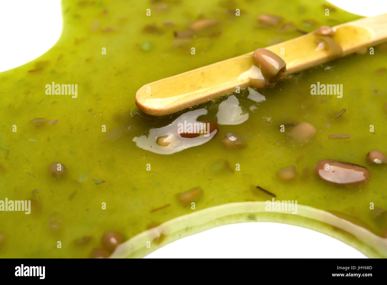 green bean popsicle completely melted on a white background Stock Photo ...