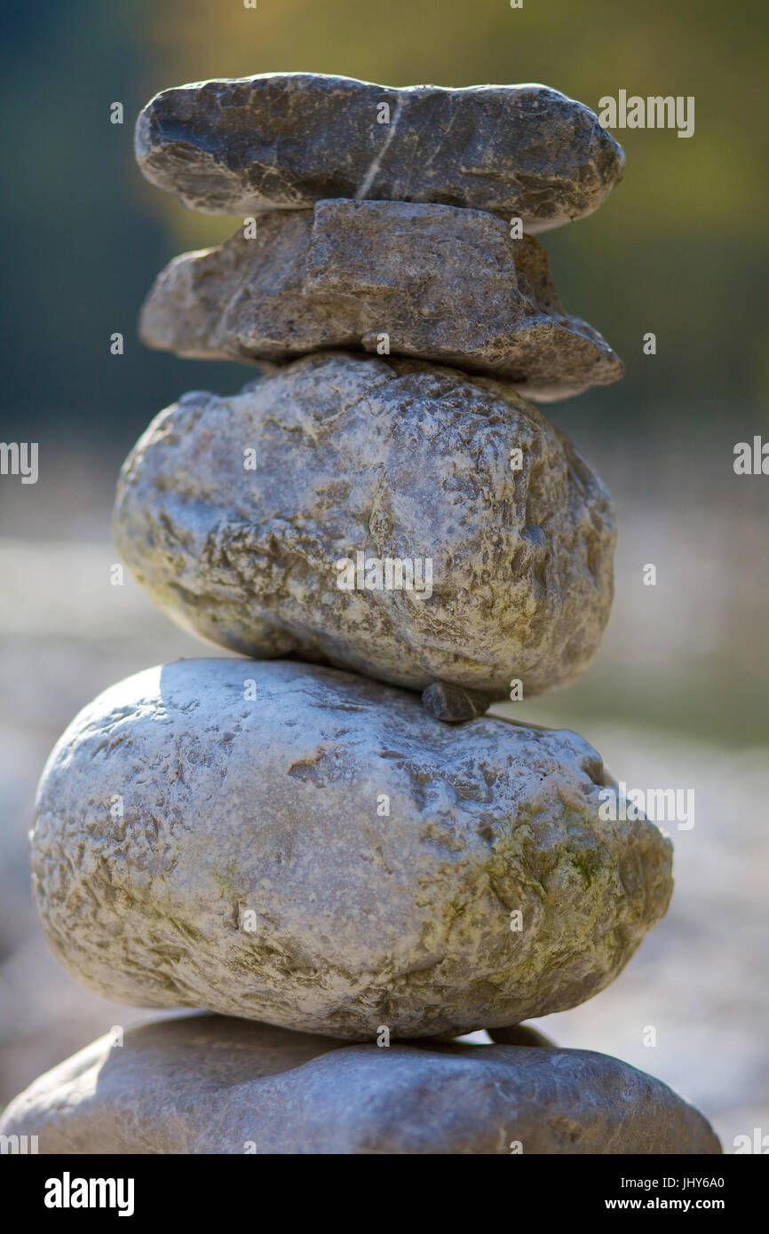 Stacked river stones in the running through, Austria, Lower Austria ...
