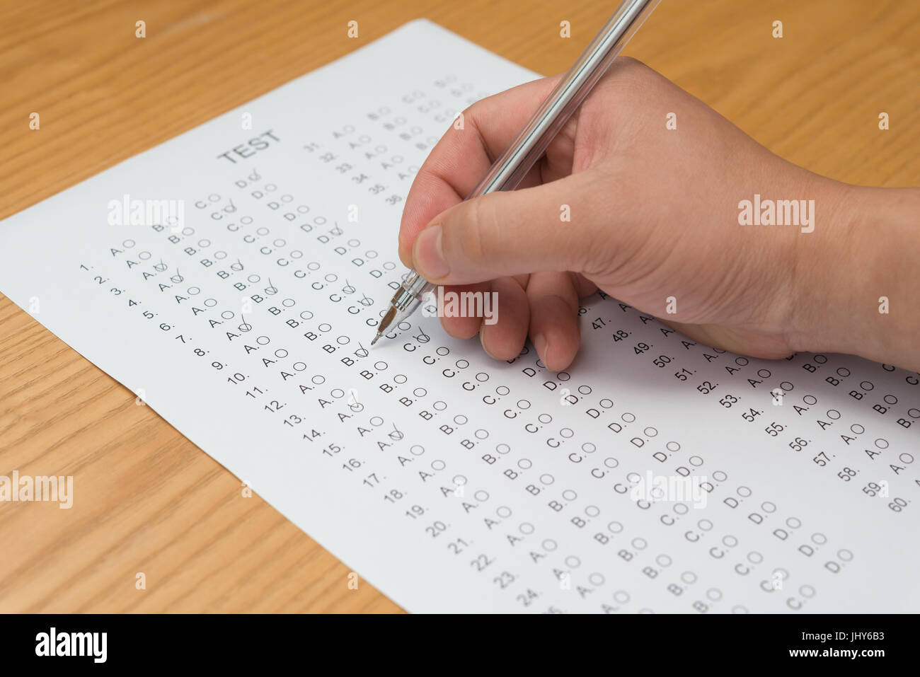 filling test score sheet with ballpoint Stock Photo - Alamy