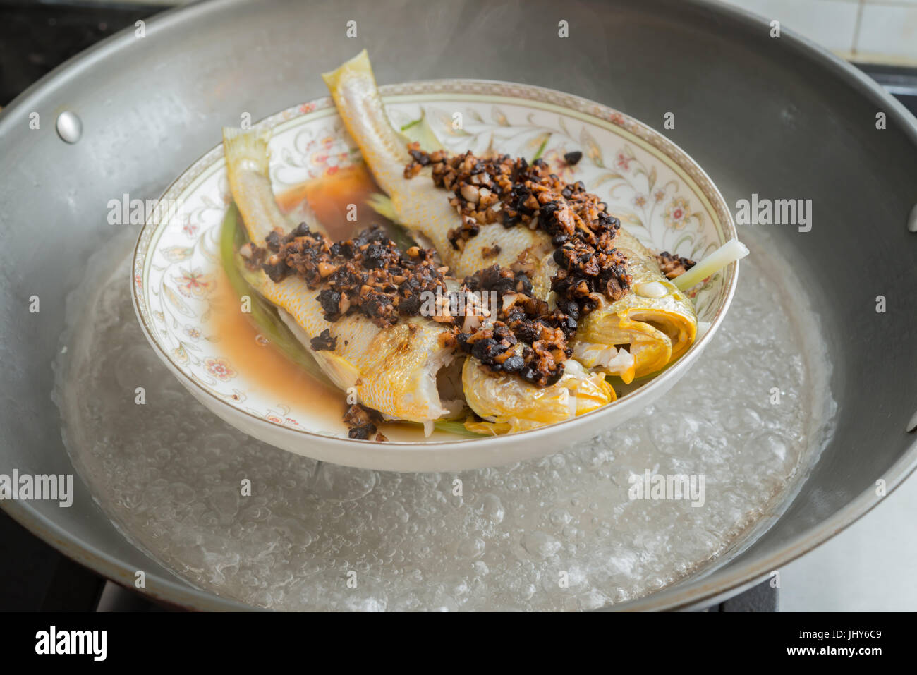 steaming a fresh fish on a pot at home Stock Photo - Alamy