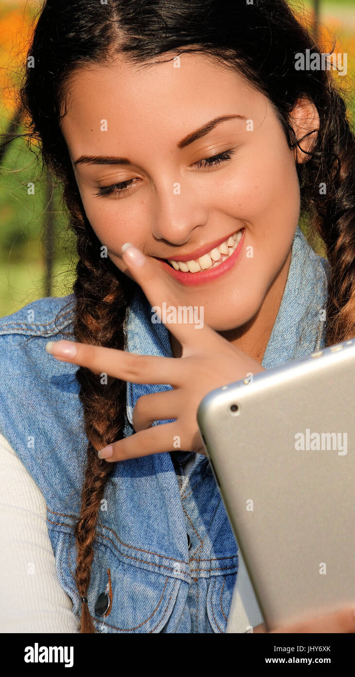 Hispanic Teenage Girl Using Tablet Stock Photo - Alamy