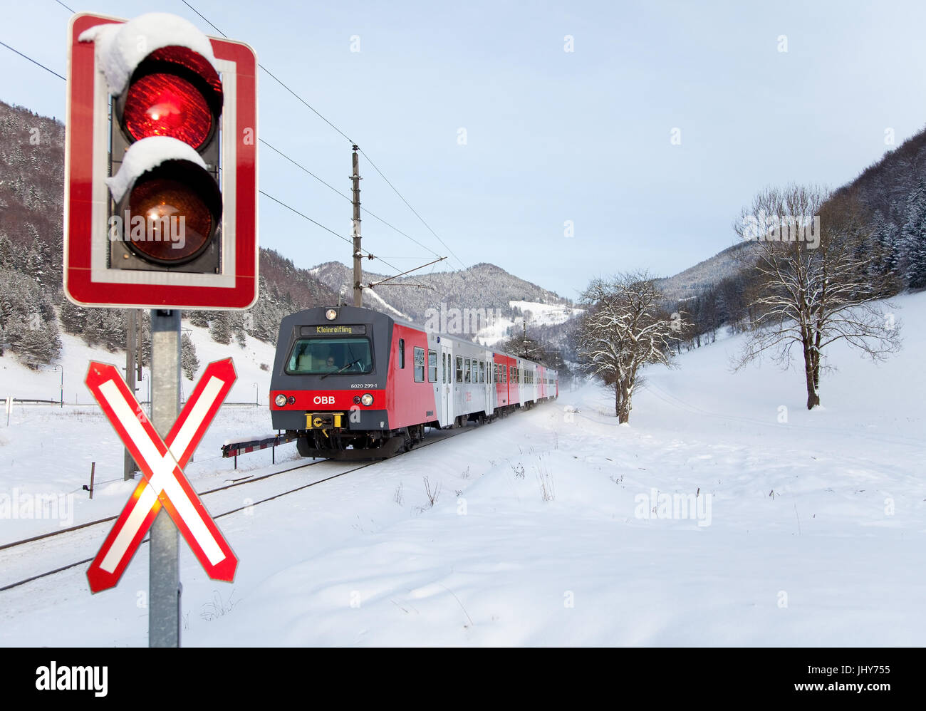 Level crossing with traffic light and train - level crossing with a ...