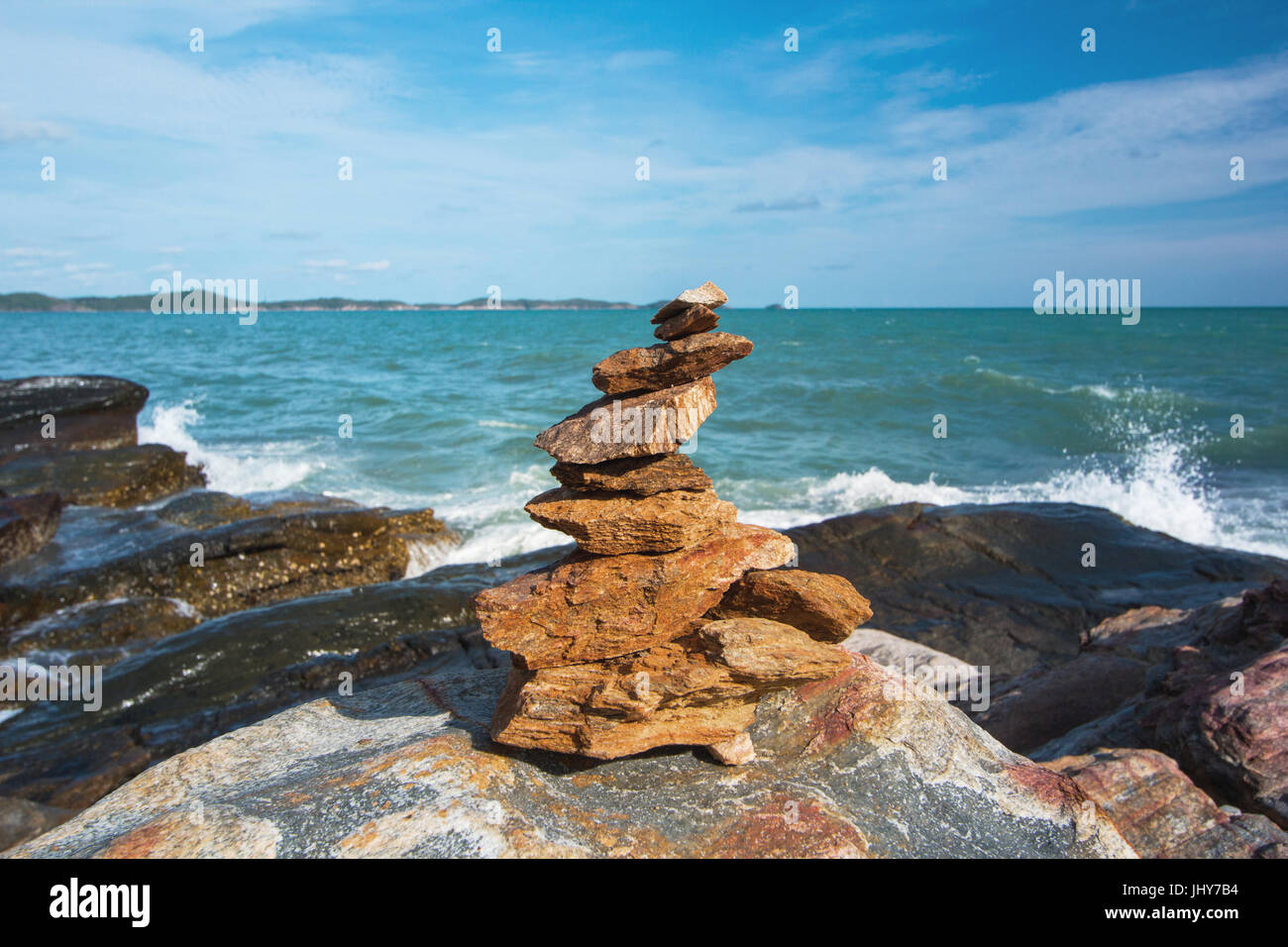 sea beach stone stack stable and wave splash abstract and blue sky ...
