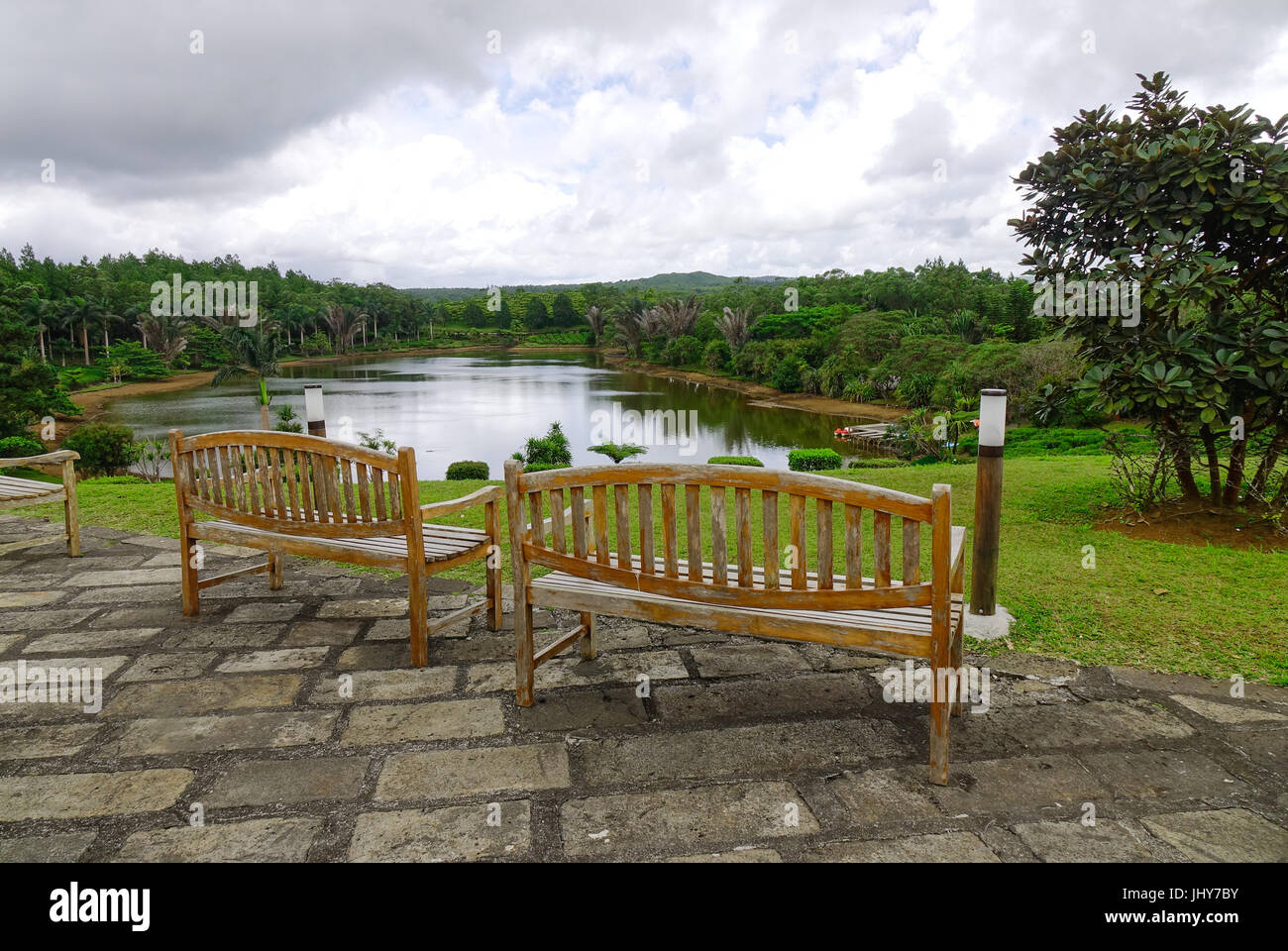Wooden benches at the botanic park with the lake in Highlands ...