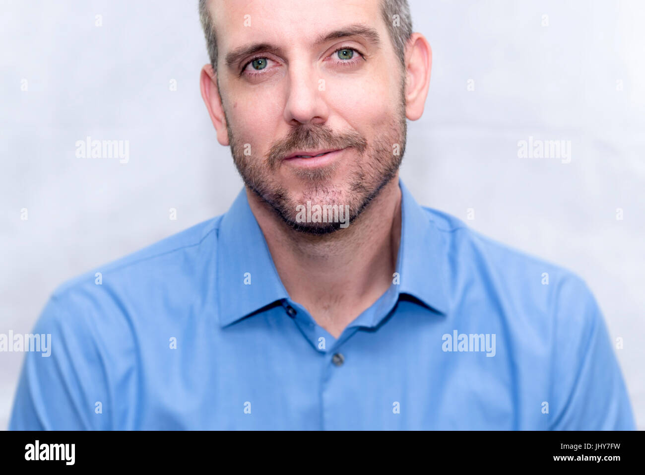 Handsome man with light beard smiling head shot Stock Photo - Alamy