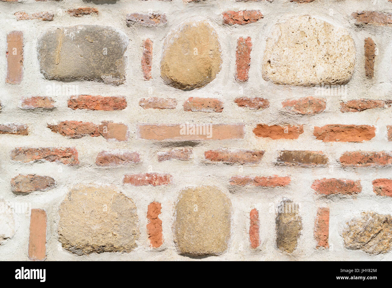 brick and stone masonry wall background Stock Photo - Alamy