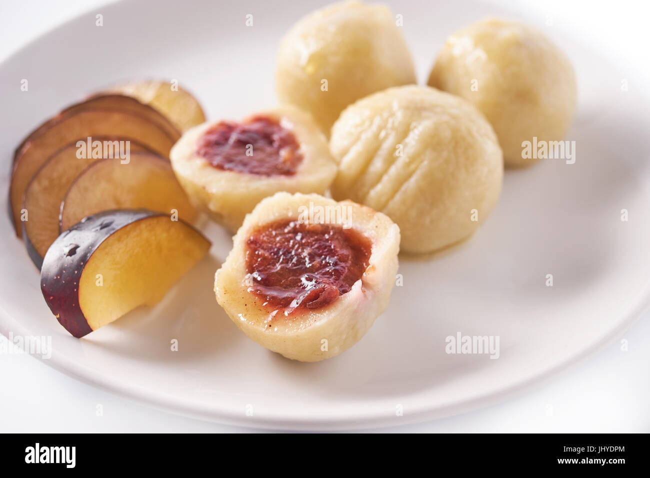 Austrian traditional dumplings filled with plum on white Stock Photo ...