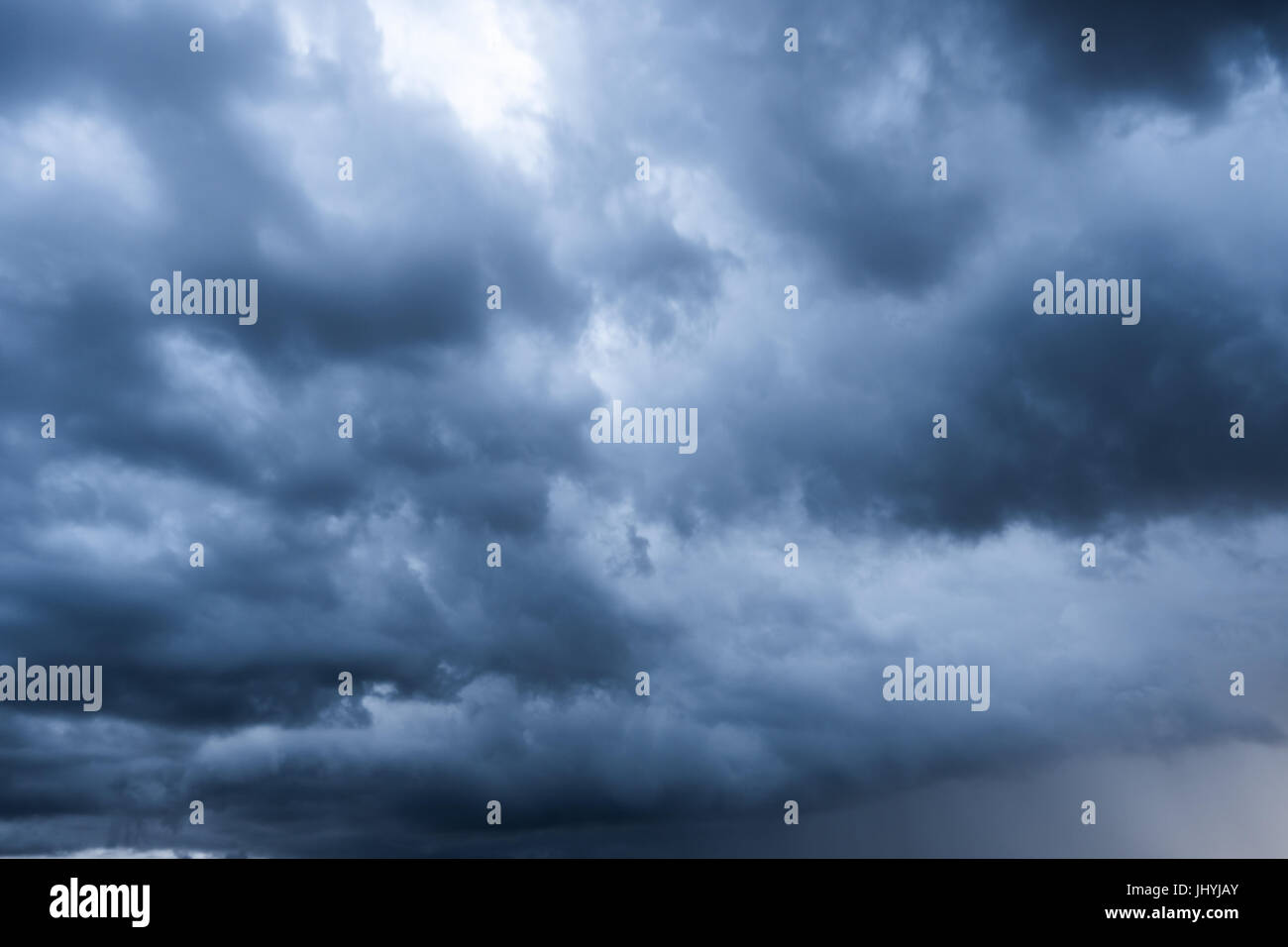 storm cloud background during raining. Dark Clouds. Huge black clouds ...