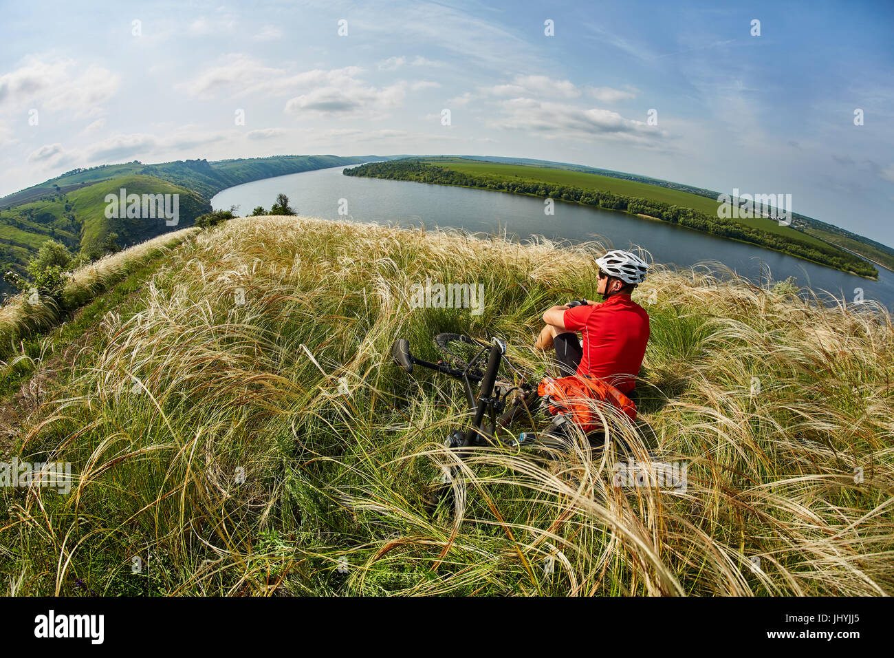 Attractive cyclist sitting on hi-res stock photography and images - Alamy