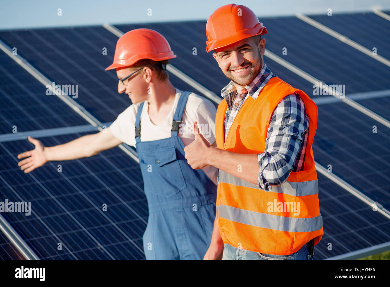 Foreman and employee at solar energy station Stock Photo - Alamy