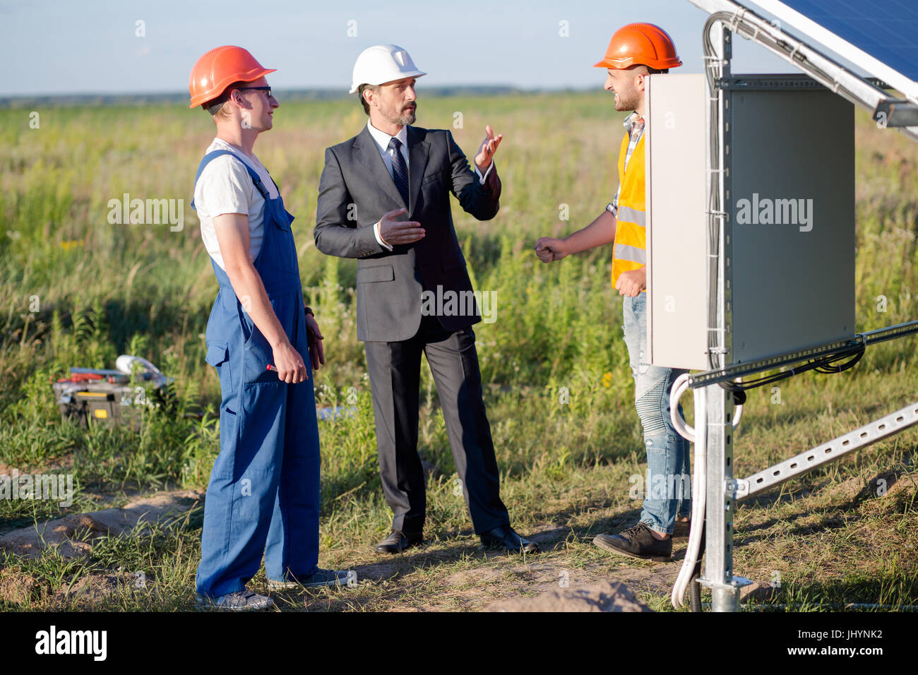 Discussion of technical details of solar panels Stock Photo - Alamy