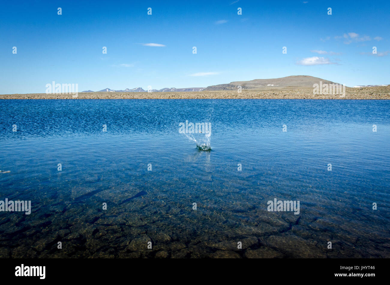 Stones on top of frozen lake hi-res stock photography and images - Alamy