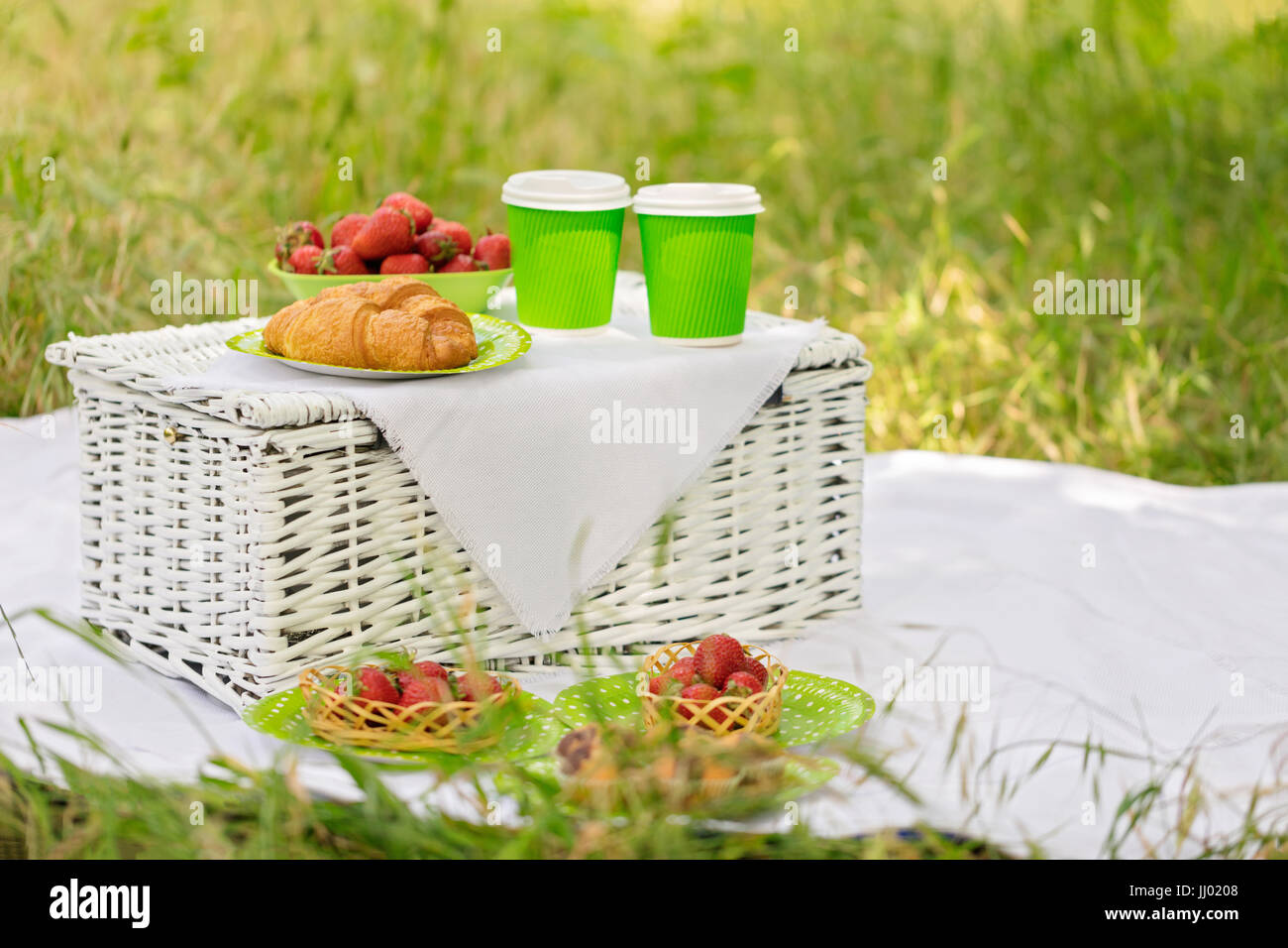 Summer time: picnic on the grass - coffee and croissants, juice and ...