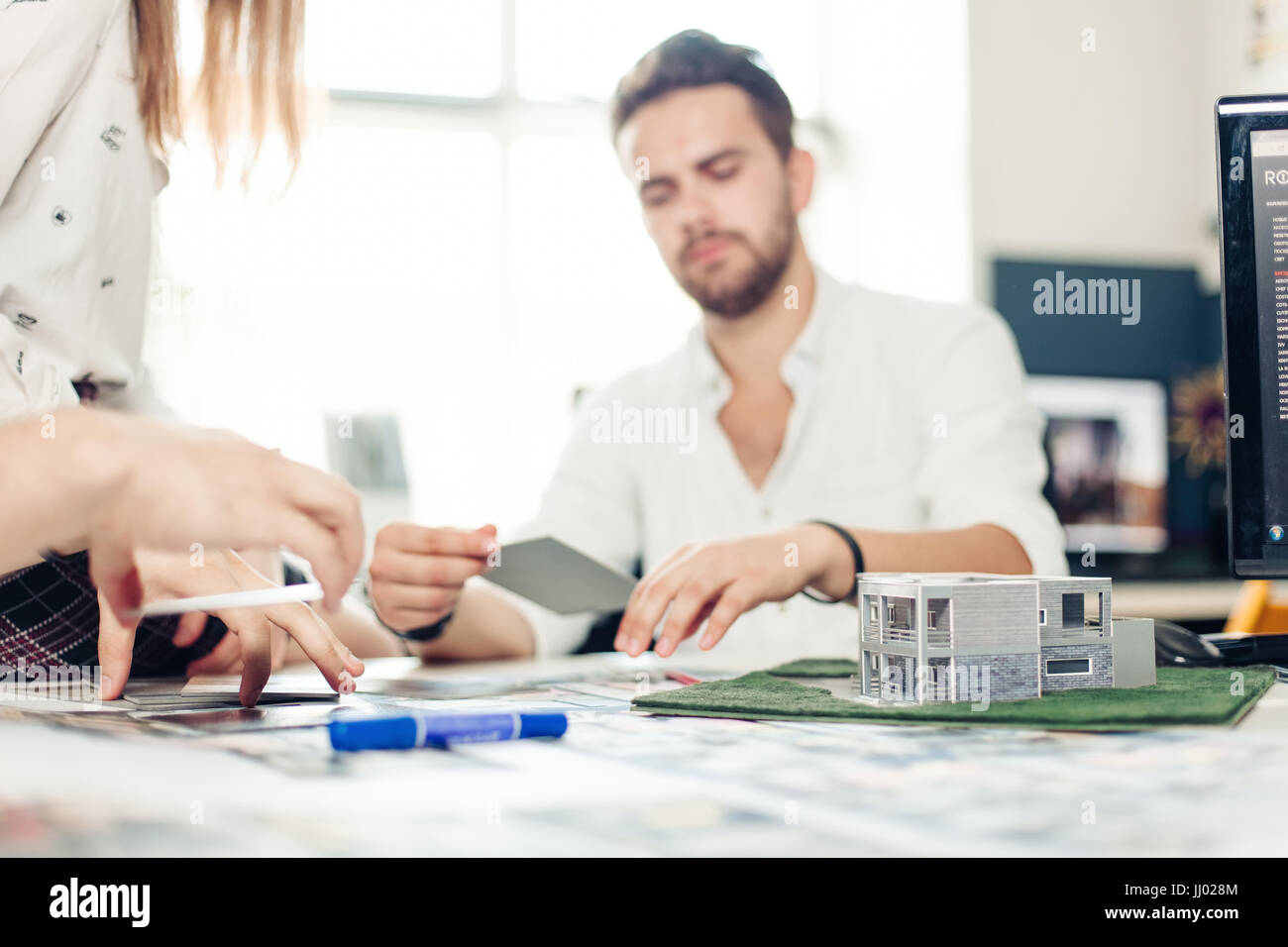 Confident team of engineers working together in a architect studio ...