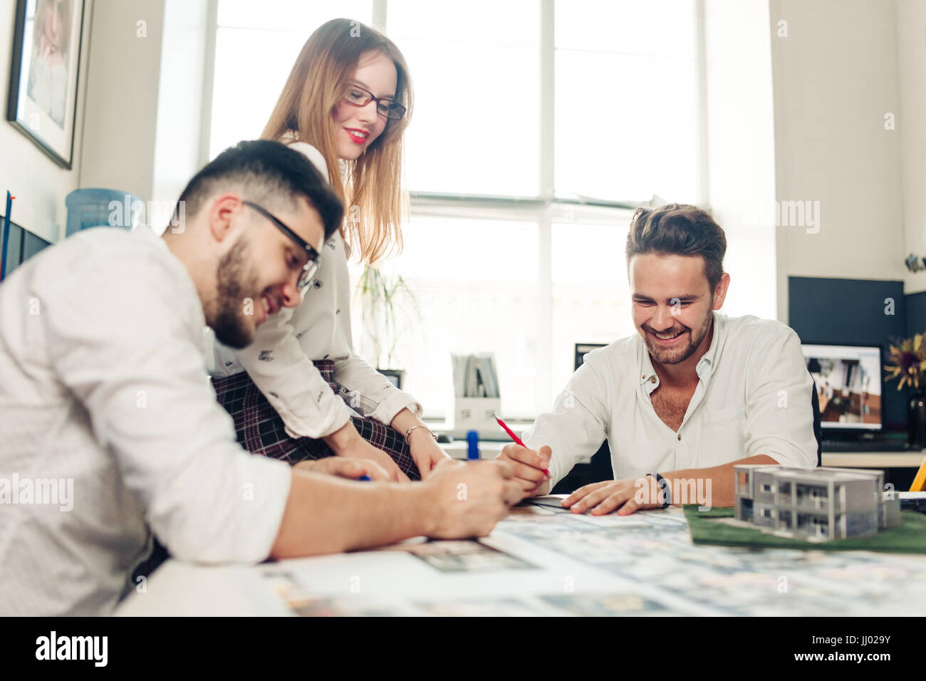 Confident team of engineers working together in a architect studio ...