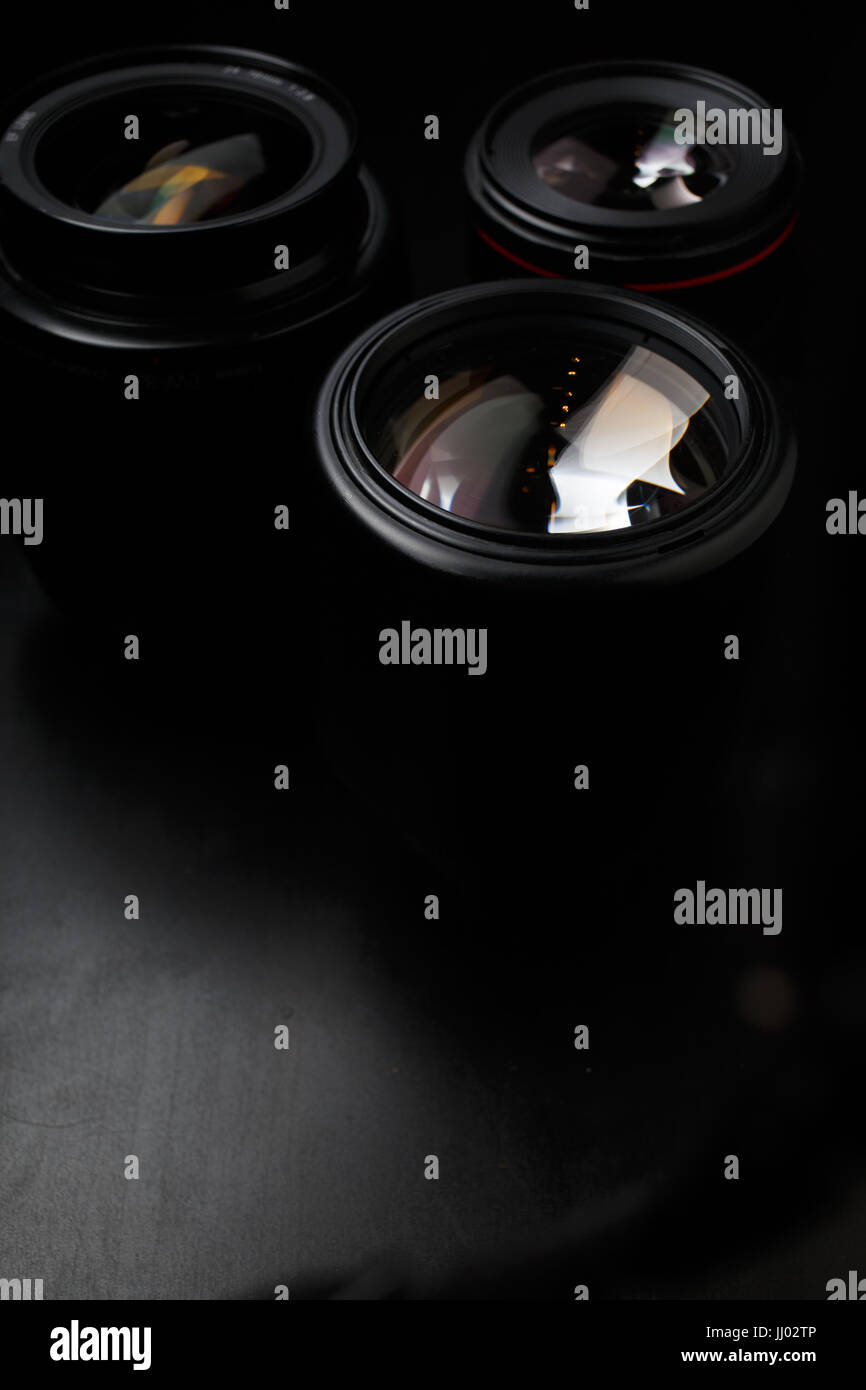 Photo of several camera lenses close-up on empty black background Stock ...