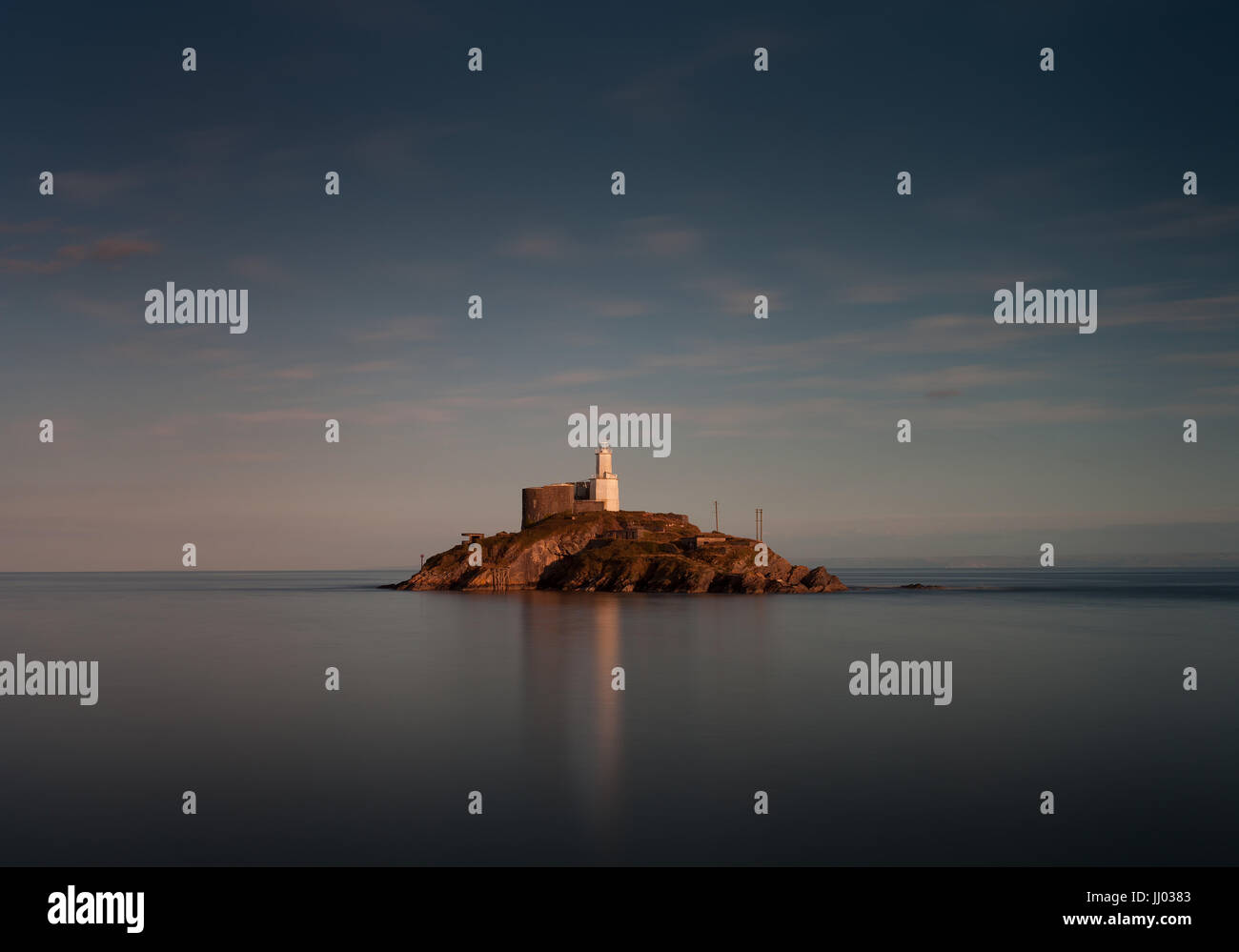 Calm sea at Mumbles lighthouse Stock Photo - Alamy