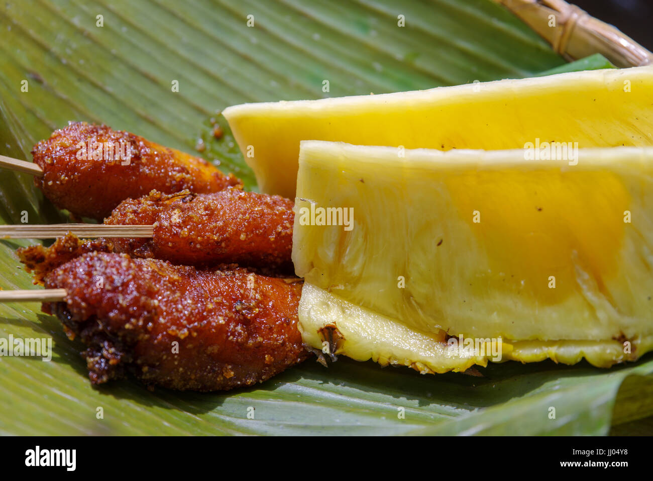 filipino traditional dessert turon(fried banana) and Pineapple Stock ...