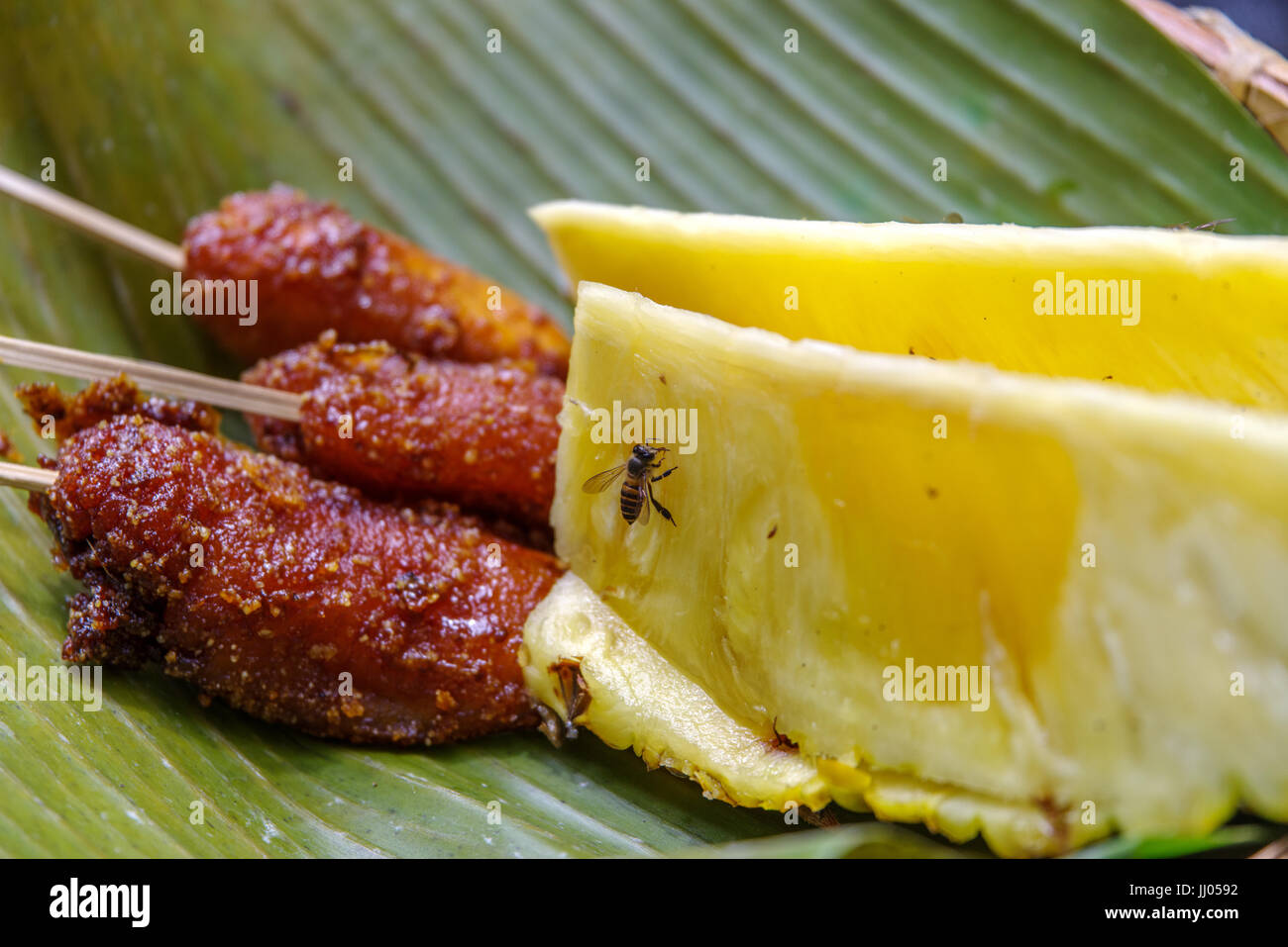 filipino traditional dessert turon(fried banana) and Pineapple Stock ...