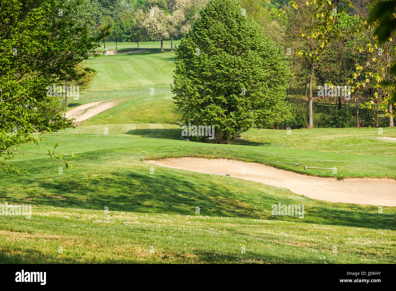 Sand bunkers on the golf course hill Stock Photo - Alamy