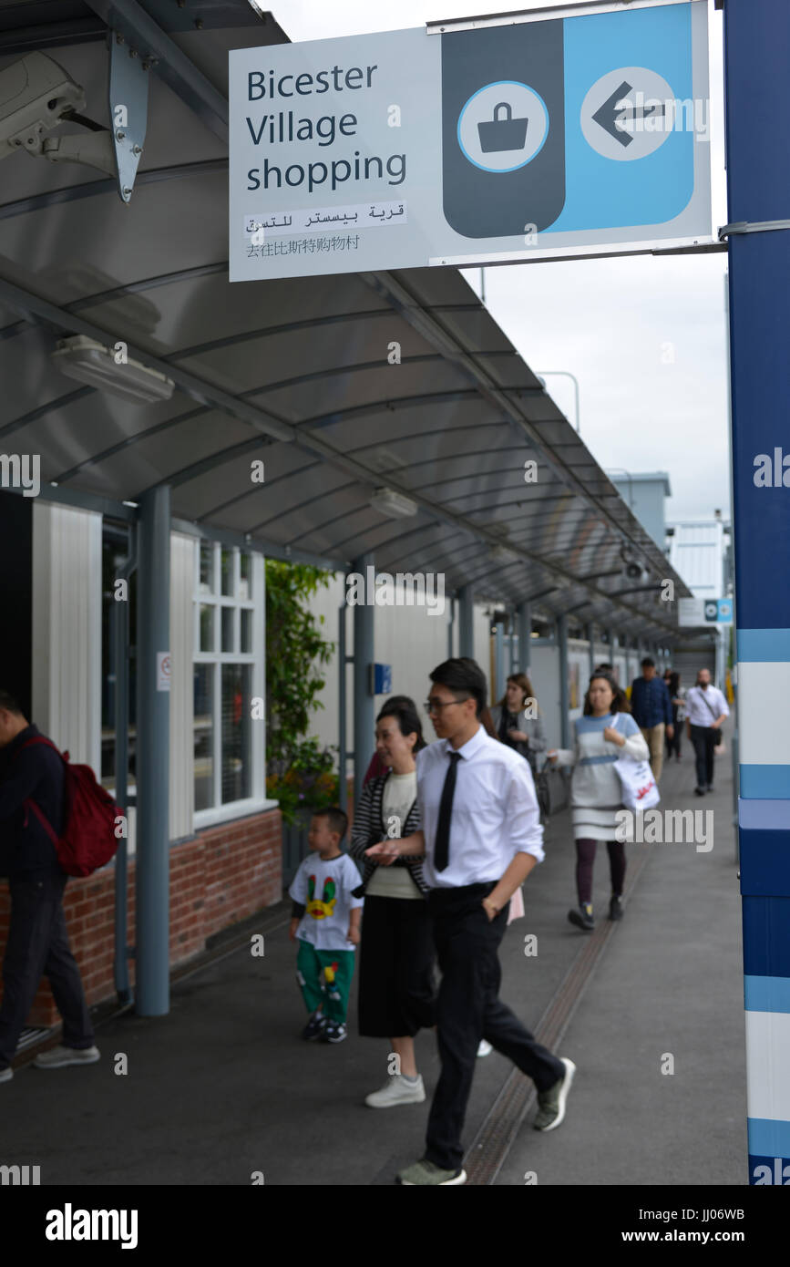 Shoppers arriving at Bicester Village rail station Stock Photo - Alamy