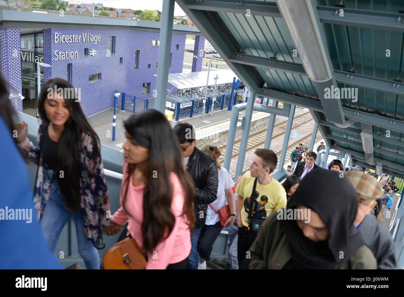 Shoppers arriving at Bicester Village rail station Stock Photo - Alamy